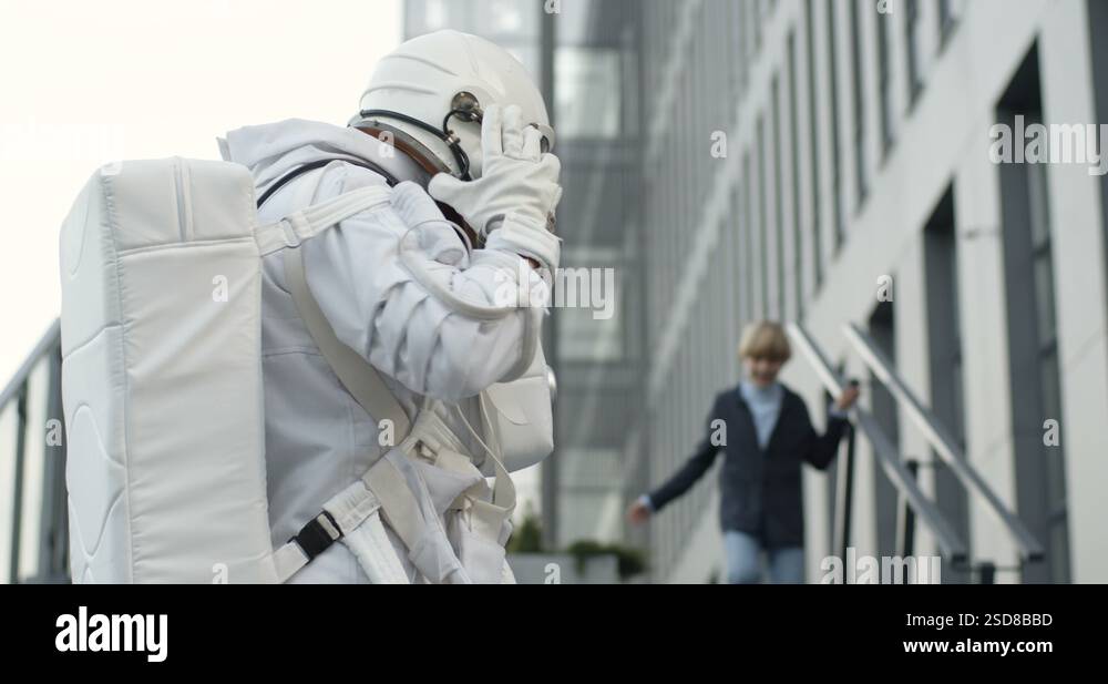 Spaceman father coming back home and his small cute son running to him ...