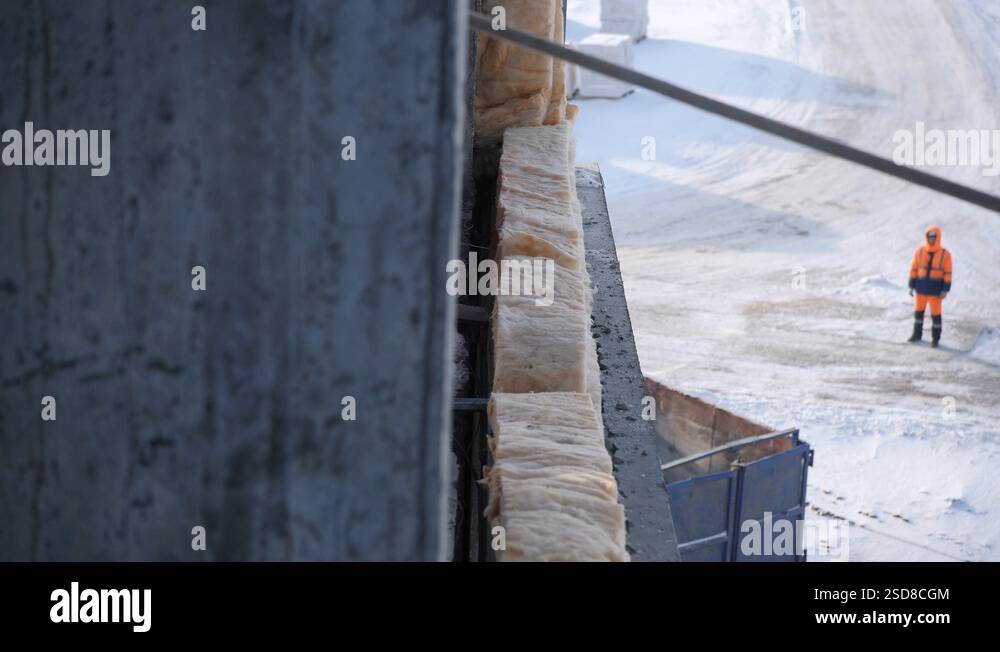 wall panel lifted by crane approaches monolithic building Stock Video ...