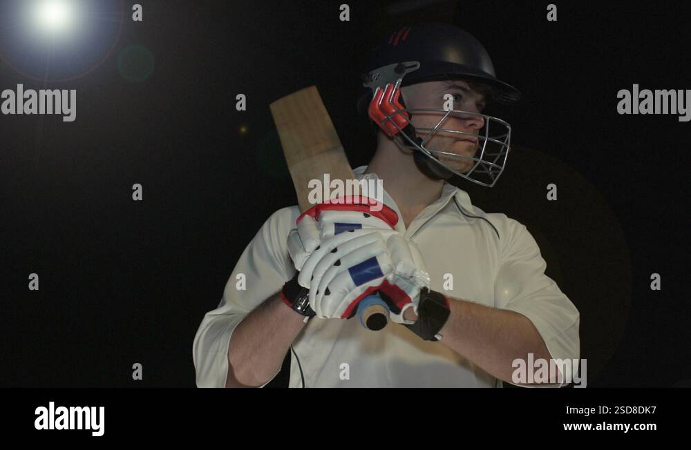 Cricket player Portrait with the bat & helmet. Super slow motion Stock ...