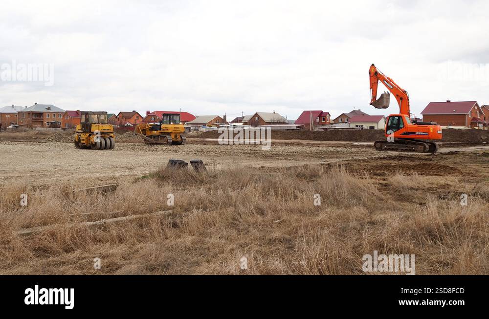 Crawler loader excavator, bulldozer and roller work on construction ...