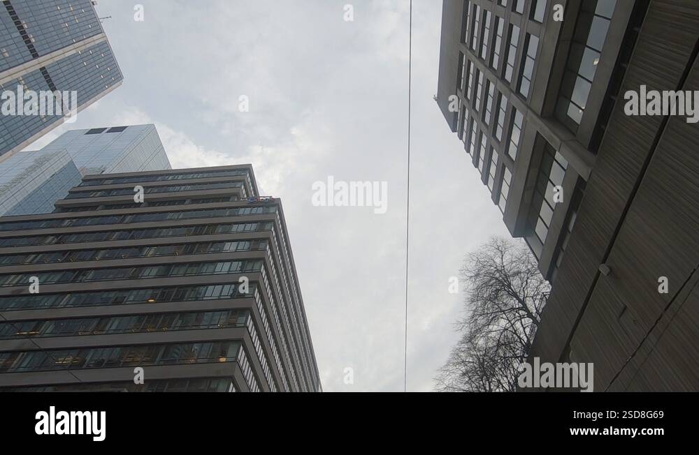POV tilt up office towers buildings and financial district in Toronto ...