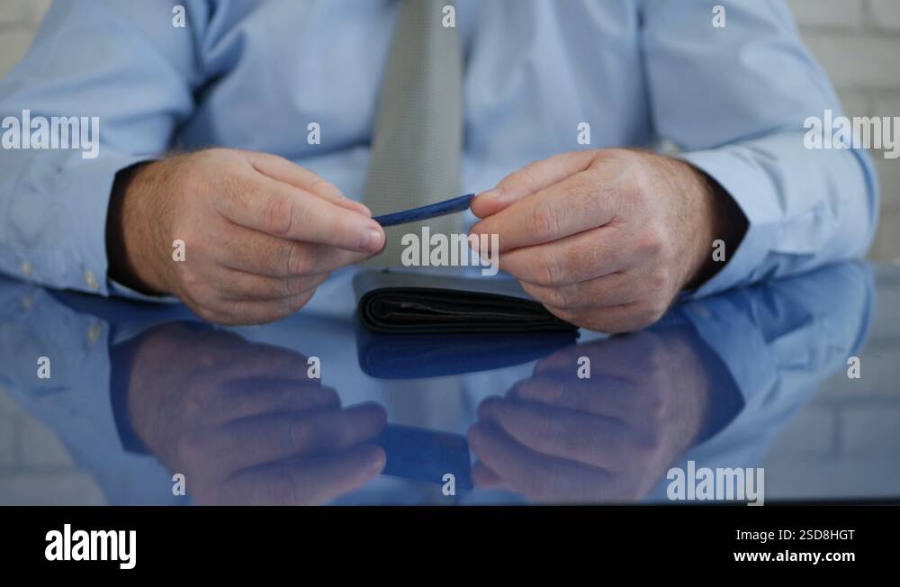 Restless Business Person Making Nervous Gestures with a Credit Card in ...