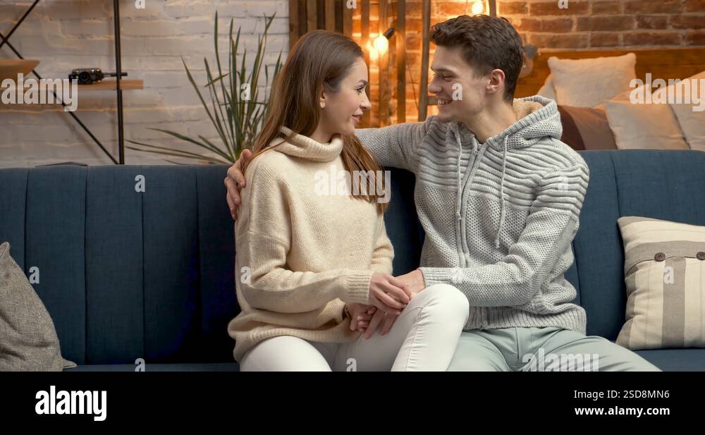 Two Lovers looking with Smile to the Camera, Couple posing at Home ...