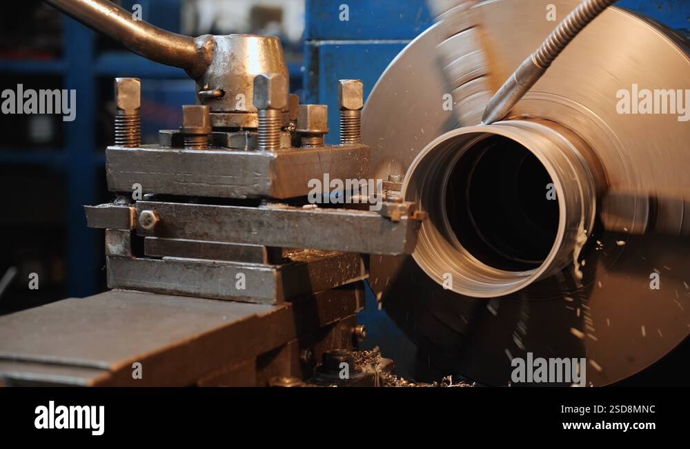 Turning bench lathe machine working with cooling liquid flowing Stock Video Footage - Alamy