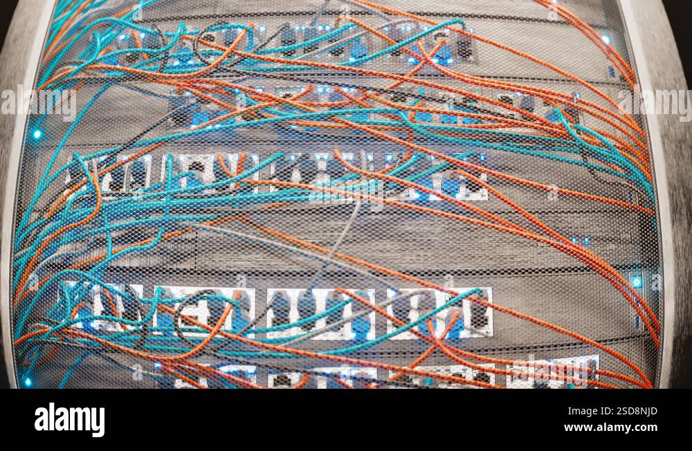 Countless colourful cables in a vintage server room cabinet lit by a ...