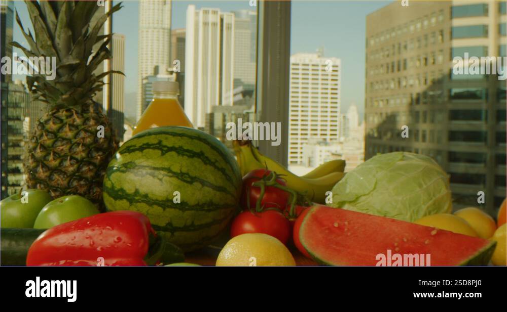 Pushing through composition of fruits and vegetables, sliding over ...