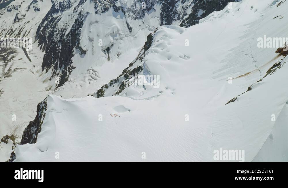 Breathtaking overhead view, highland alpinists camp on huge snow ...