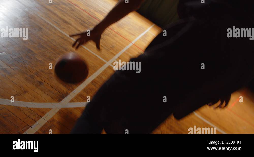 Young curly professional basketball player playing throwing the ball ...