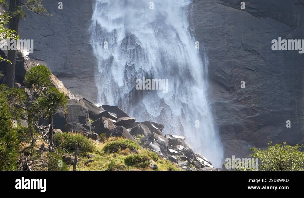 Slow Motion of Water Falling Over Granite Cliff on Sunny Summer Day ...