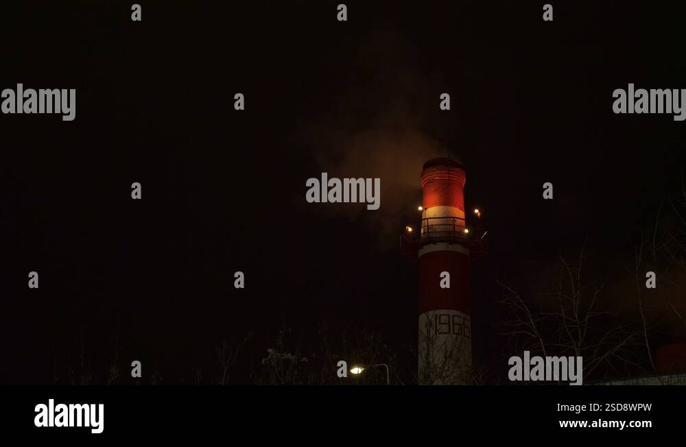Smoke comes from the pipe of the thermal power plant. Night time Stock ...