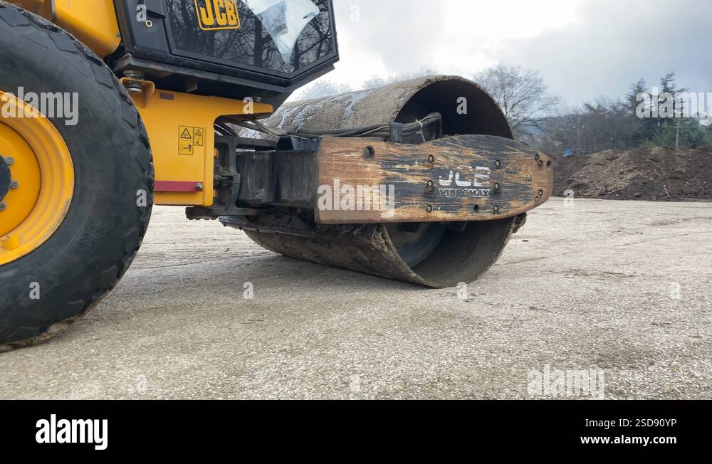 JCB single drum soil compactor working on construction site Stock Video ...
