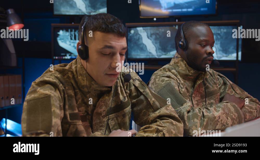 Multiethnic military men in uniforms and headsets talking and ...