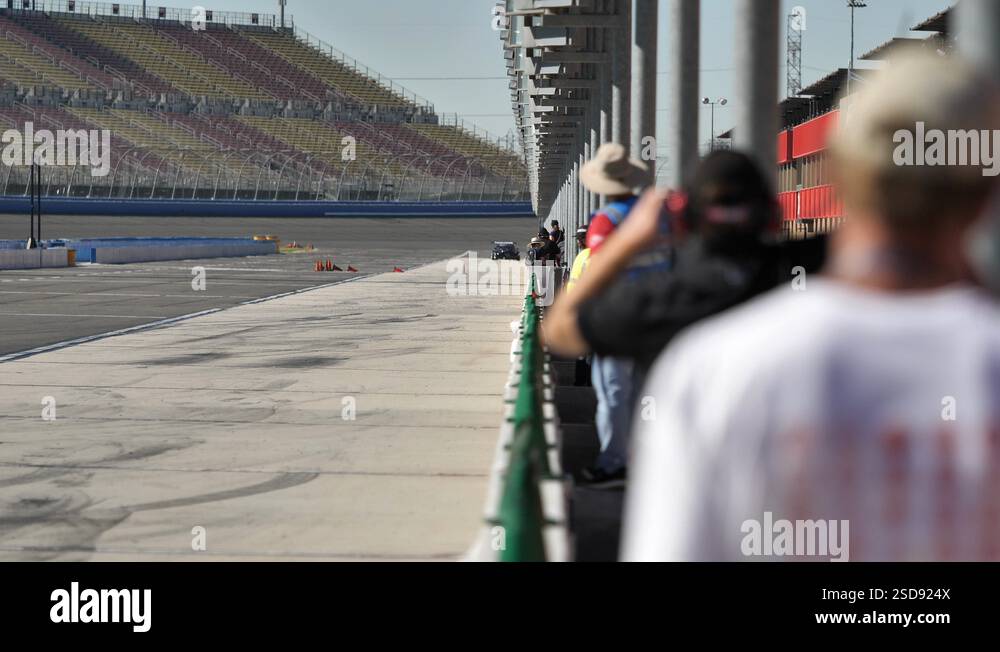 Race Track Workers Waiting on Pit Lane for Car Stock Video Footage - Alamy