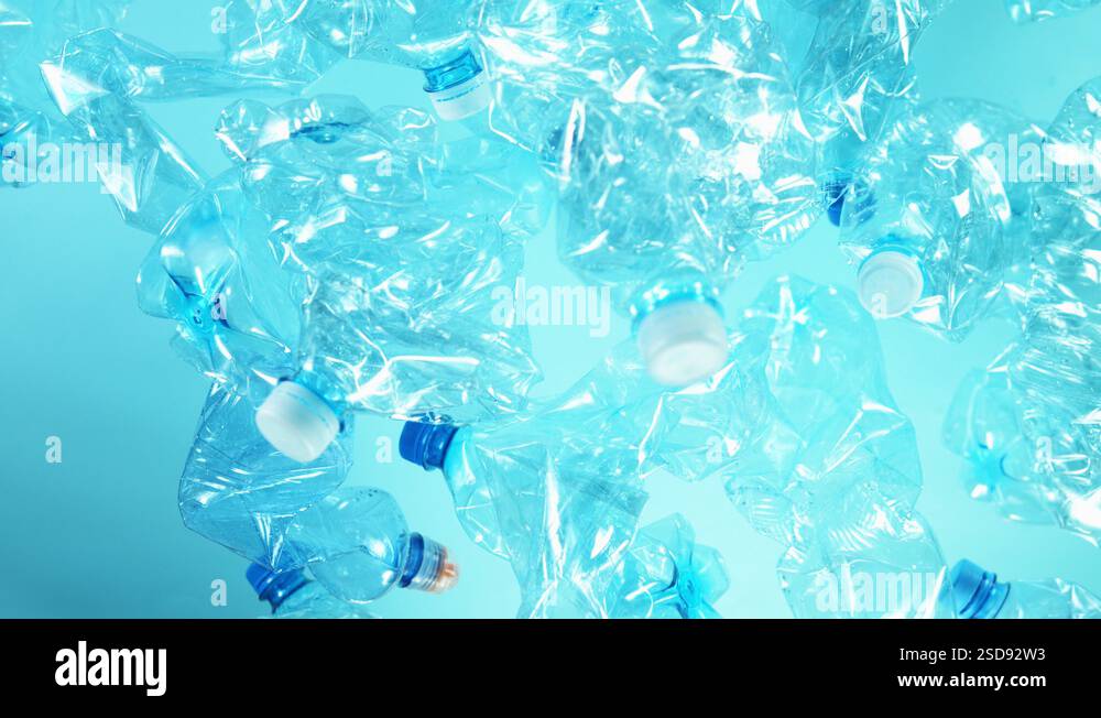 Super slow motion of empty plastic bottles flying into the air Stock ...
