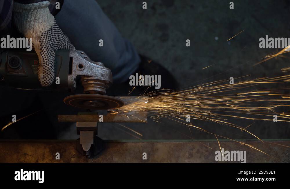 Man works in his garage. Saws iron with a saw on metal Stock Video ...