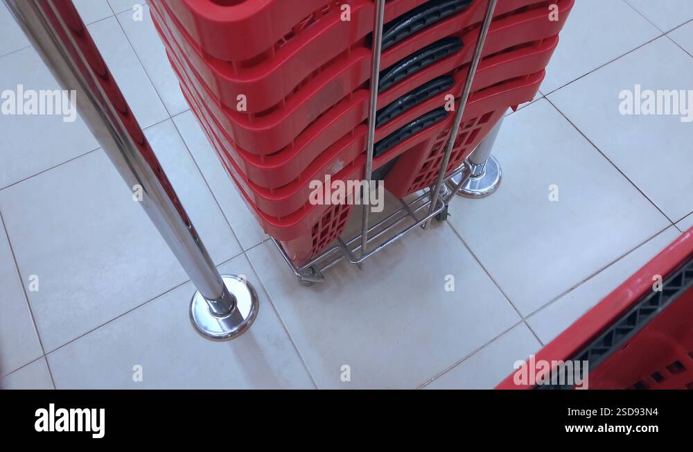 Close up of red baskets on top of each other in a supermarket Stock ...