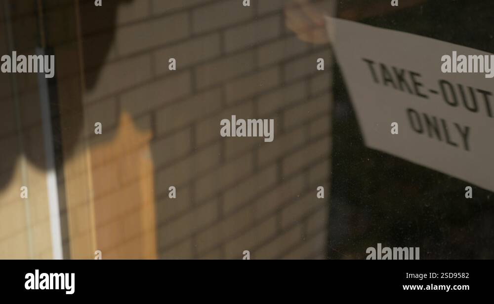 Restaurant Owner Puts Take Out Only Sign on Door Stock Video Footage ...