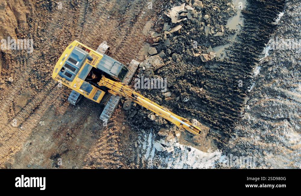 Working machine digs earth at a career. Construction equipment, heavy ...
