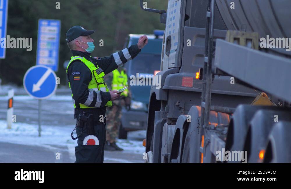 Lithuanian border guard officer control cargo truck at the Lithuania ...