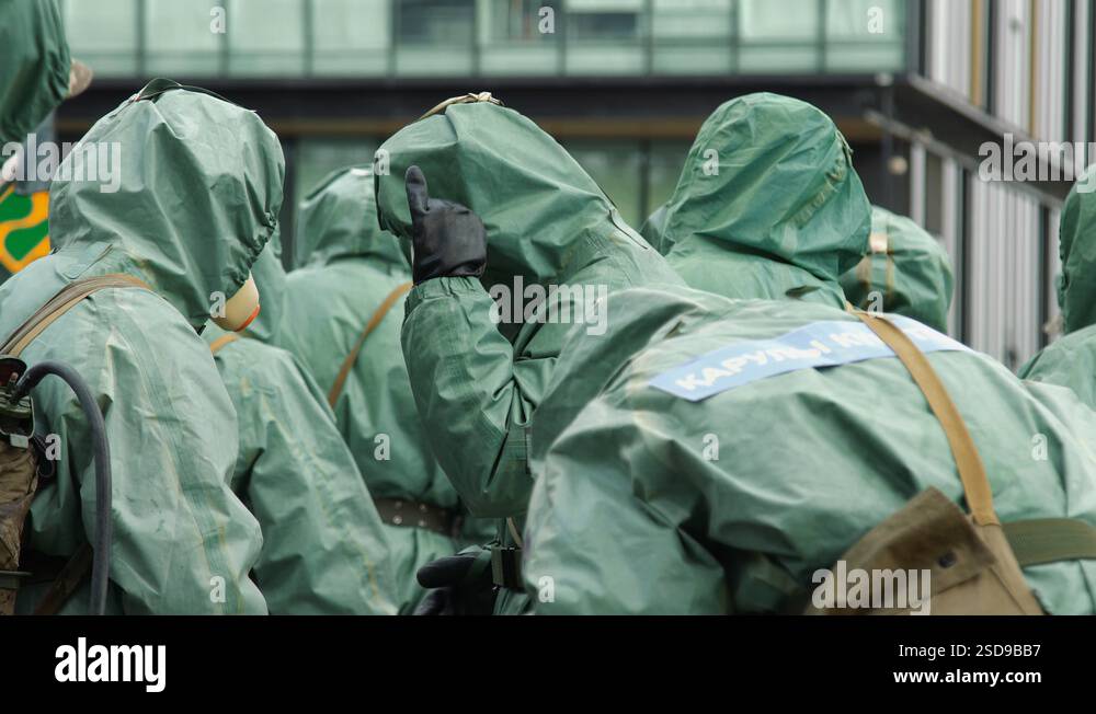 People in bio viral hazard protective suits. Disinfection and ...