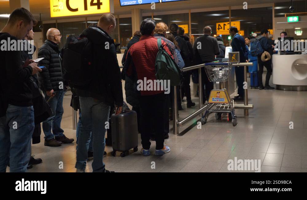 queue stands by airport flight gate and waits for boarding Stock Video ...