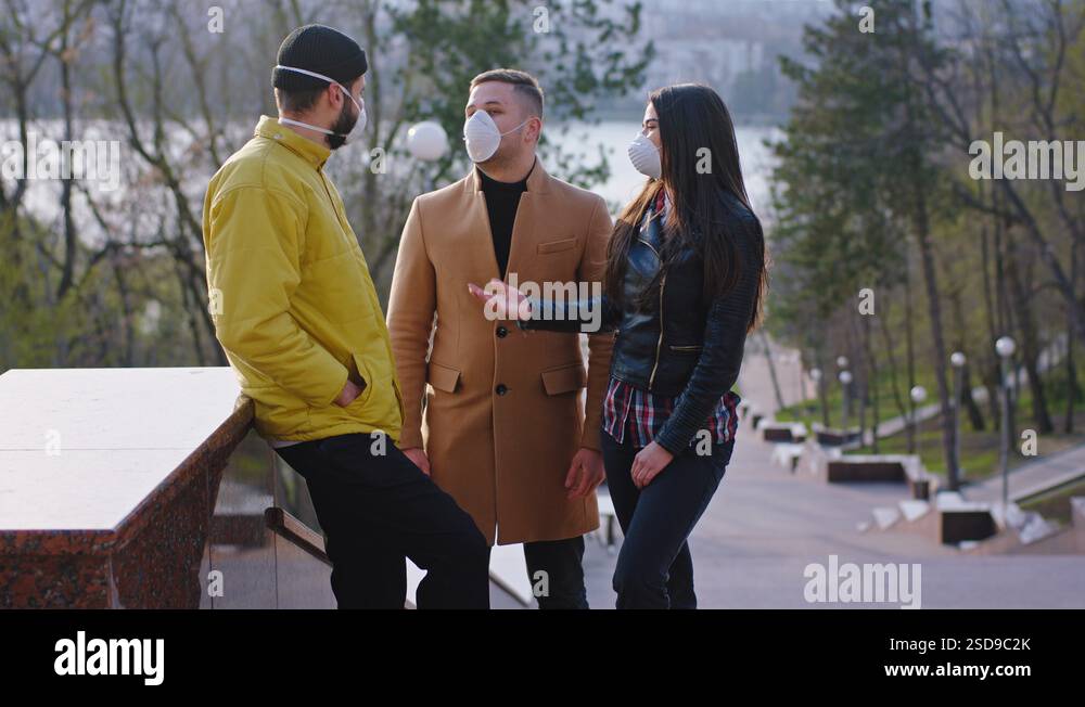 Young students have a discussion in the park they talking through the ...