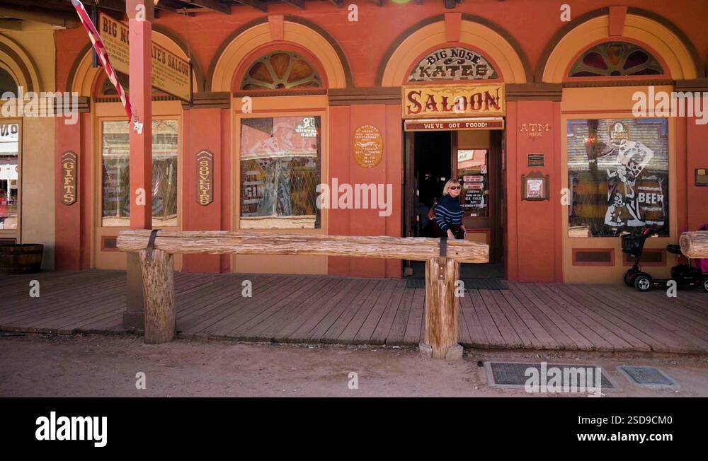 A female tourist walking out of the famous Big Nose Kate Saloon in the ...
