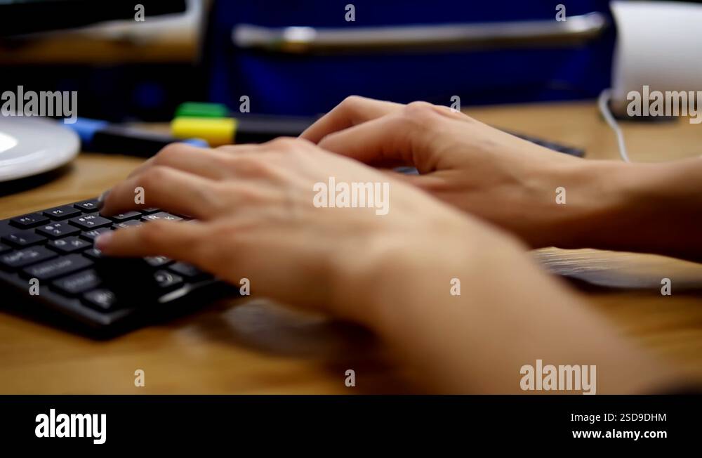 Office employee is typing on a keyboard. Bright office with a diverse ...