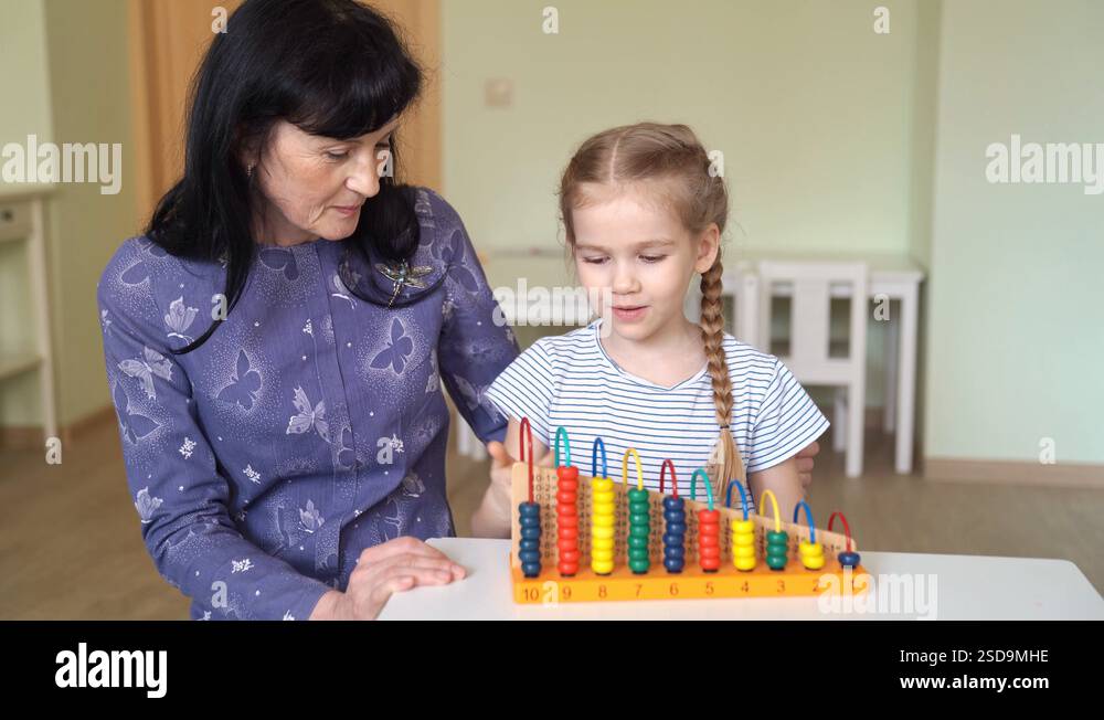 a teacher with girl learning to add and subtract Stock Video Footage ...