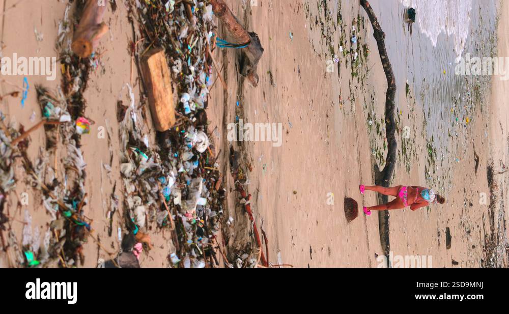 Sea waves full of litter hitting the beach. Huge dump in tropical ...