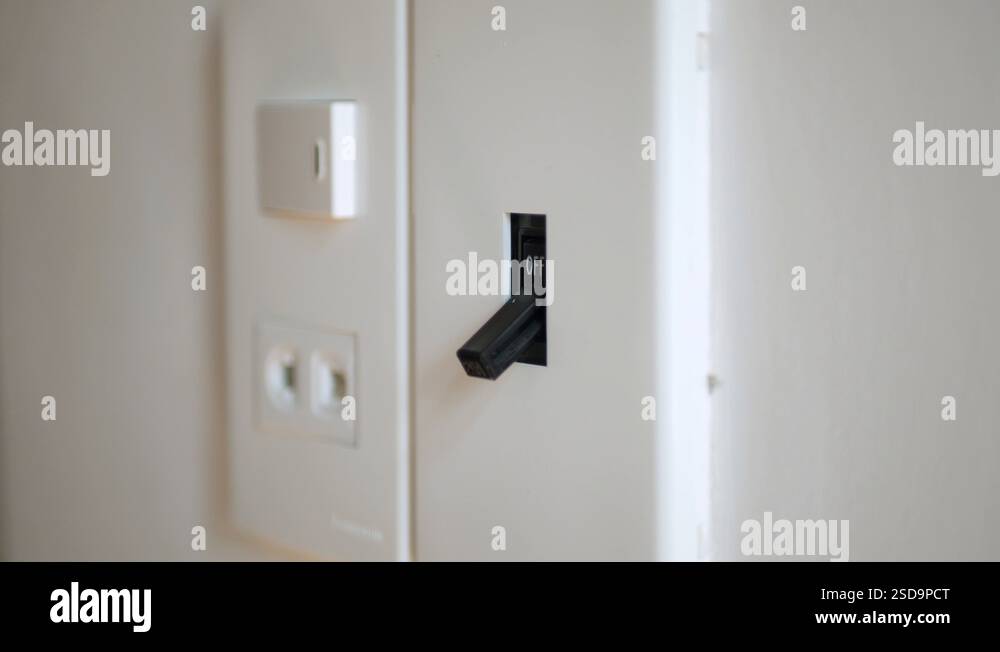 Light is On. Male hand turn on electric breaker switch. 4k Stock Video ...