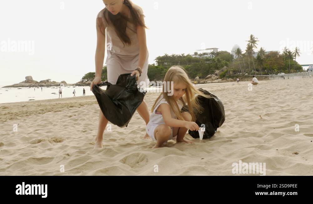 People clear the sea and the coast of garbage Stock Video Footage - Alamy