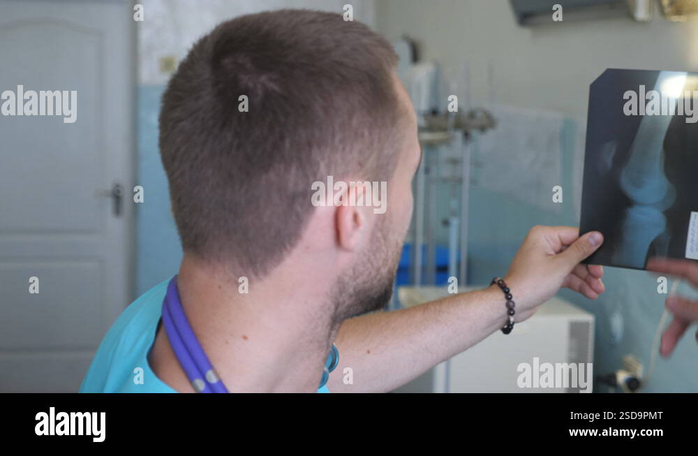 Medical workers in hospital looking and analizing x-ray prints. Medic ...