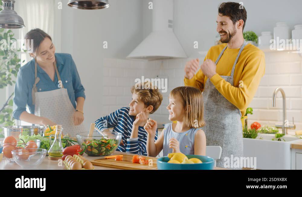 In Kitchen: Family of Four with Little Children Cooking Together ...