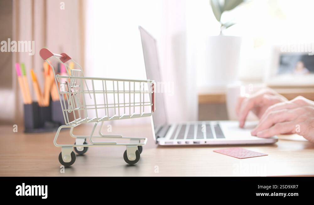 HP logo on boxes in shopping cart near the laptop. Editorial online ...