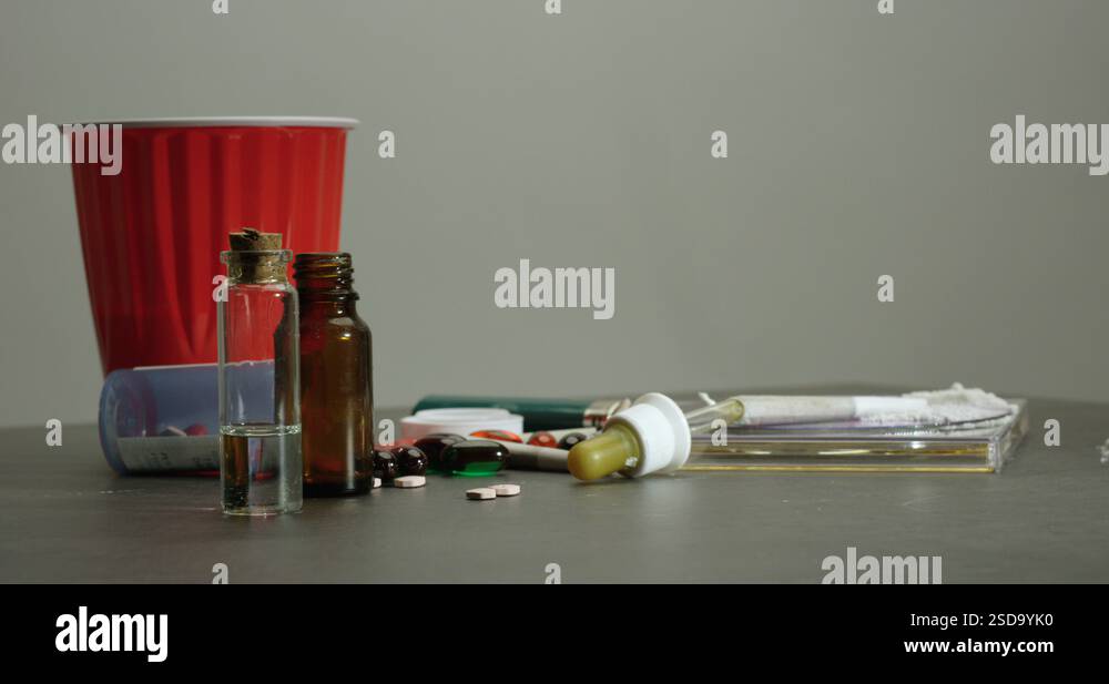 Beer cocaine quaaludes and other drugs on counter - side profile Stock ...