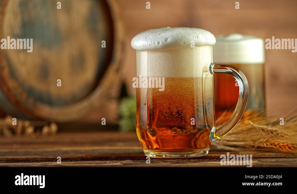 Super Slow Motion Shot of Overflowing Fresh Beer in Glass on Black ...