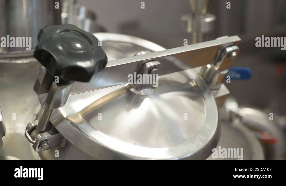 Equipment at the factory. Close-up of a metal jar with a lid Stock ...