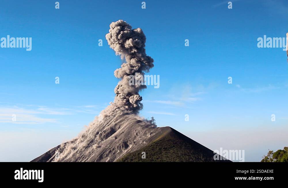 Fuego volcano, near Antigua, Guatemala, erupts heavily on a sunny day ...