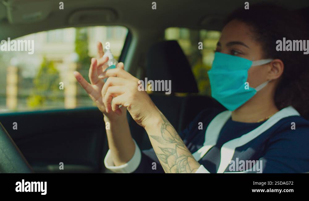 Woman in car using hand sanitizer to prevent infection Stock Video ...