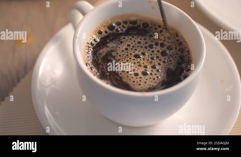 hand stirring coffee Stock Video Footage - Alamy