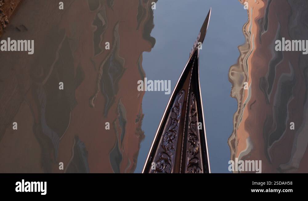Top down overhead angle of a gondola passing along a canal through ...