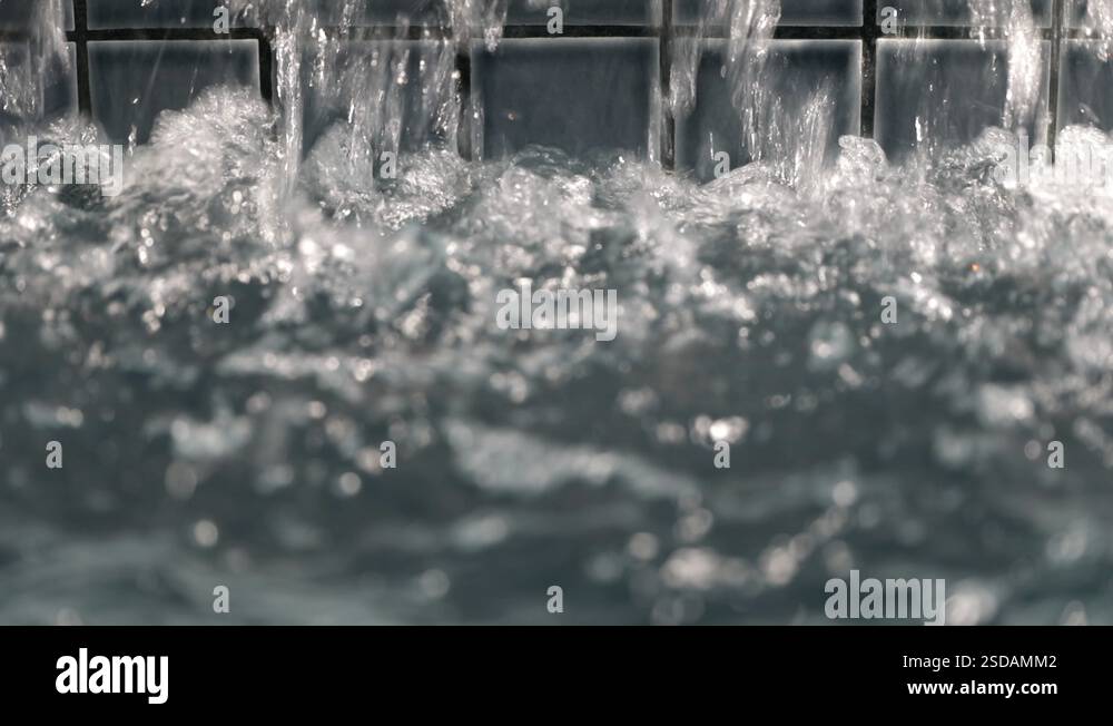 Close Up Drops of Water From Fountain Colliding in the Pond Forming ...