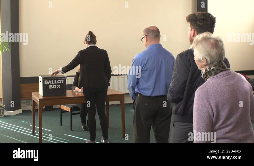People Queuing to Vote in the Election. There is a Ballot Box on the ...