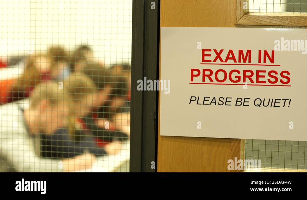 College Students - Exam in Progress sign on door. University Lecture ...