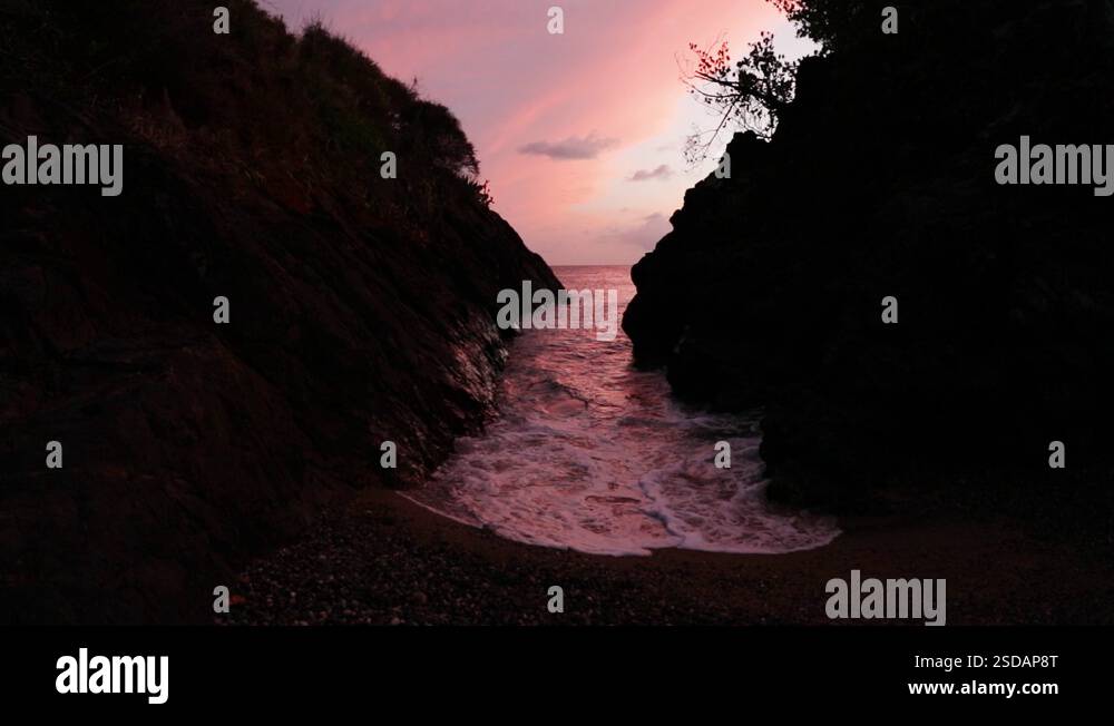 Red sky breaking through a beautiful ocean channel in Tobago Stock ...