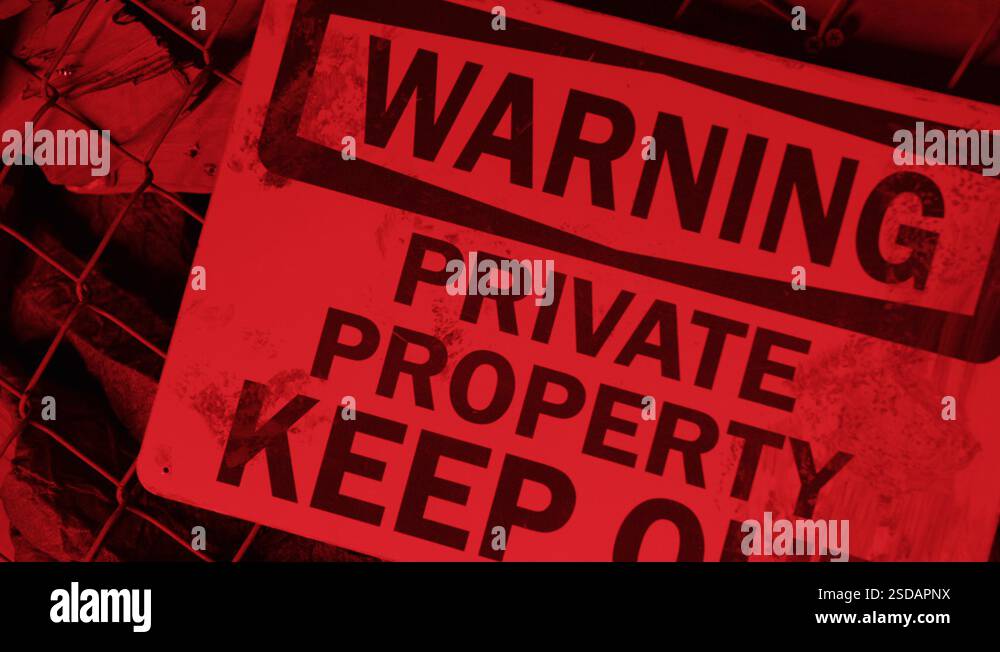 Warning sign on a grid in abandoned area, warning private property keep ...