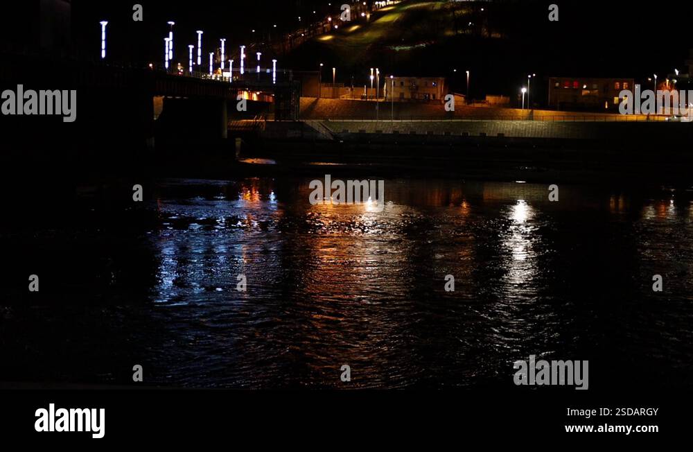 An amazing view at the lake under the bridge with light reflecting on ...