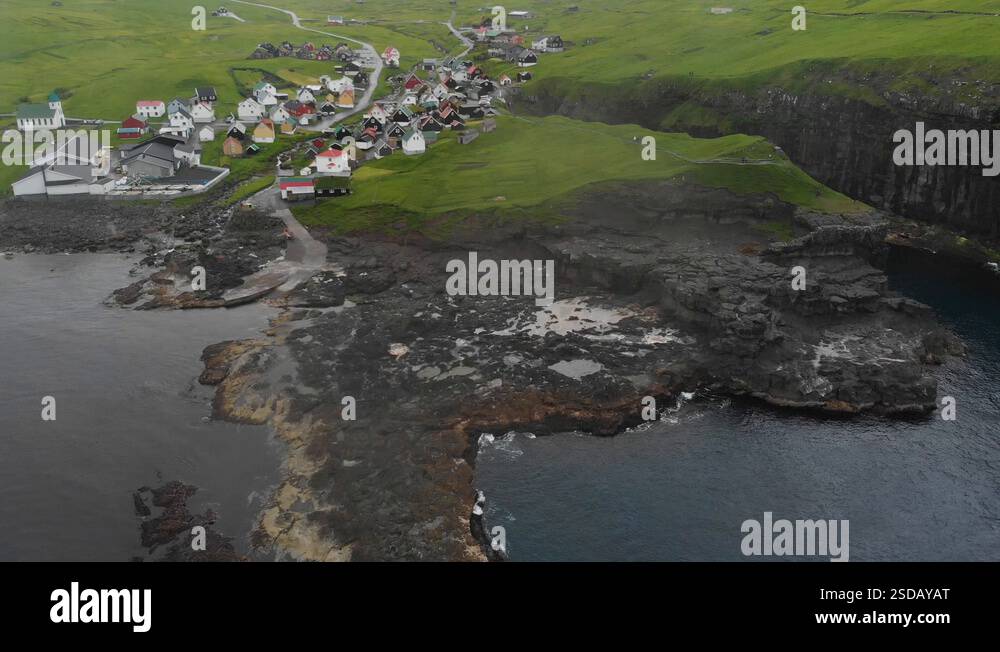 Aerial of small town at sea at the Faroe Islands while raining Stock ...