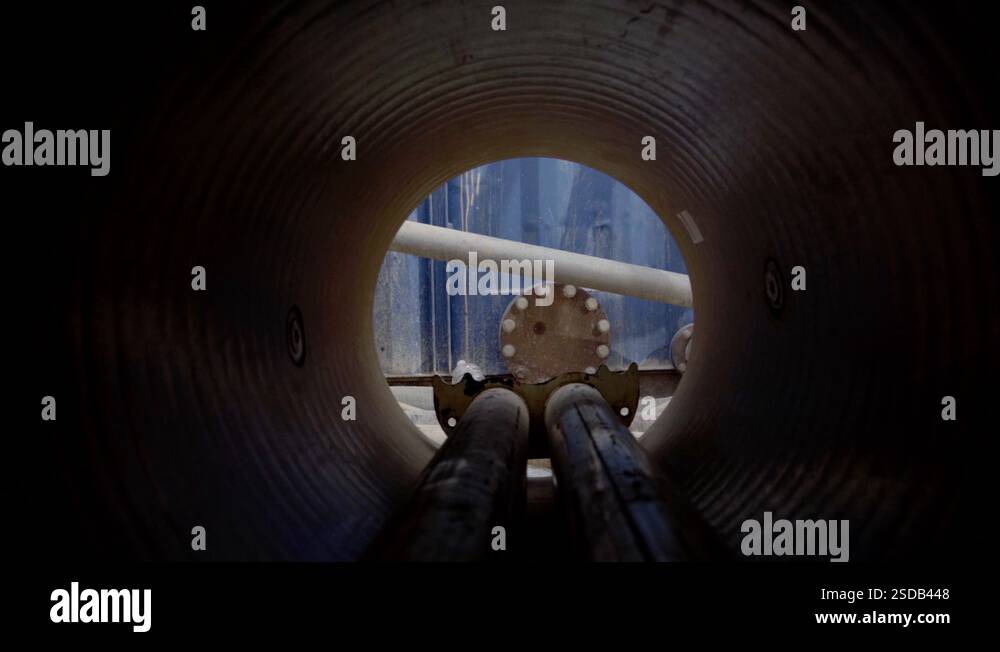Swirl orbit shot on an empty tube pipe tunnel at construction site made ...
